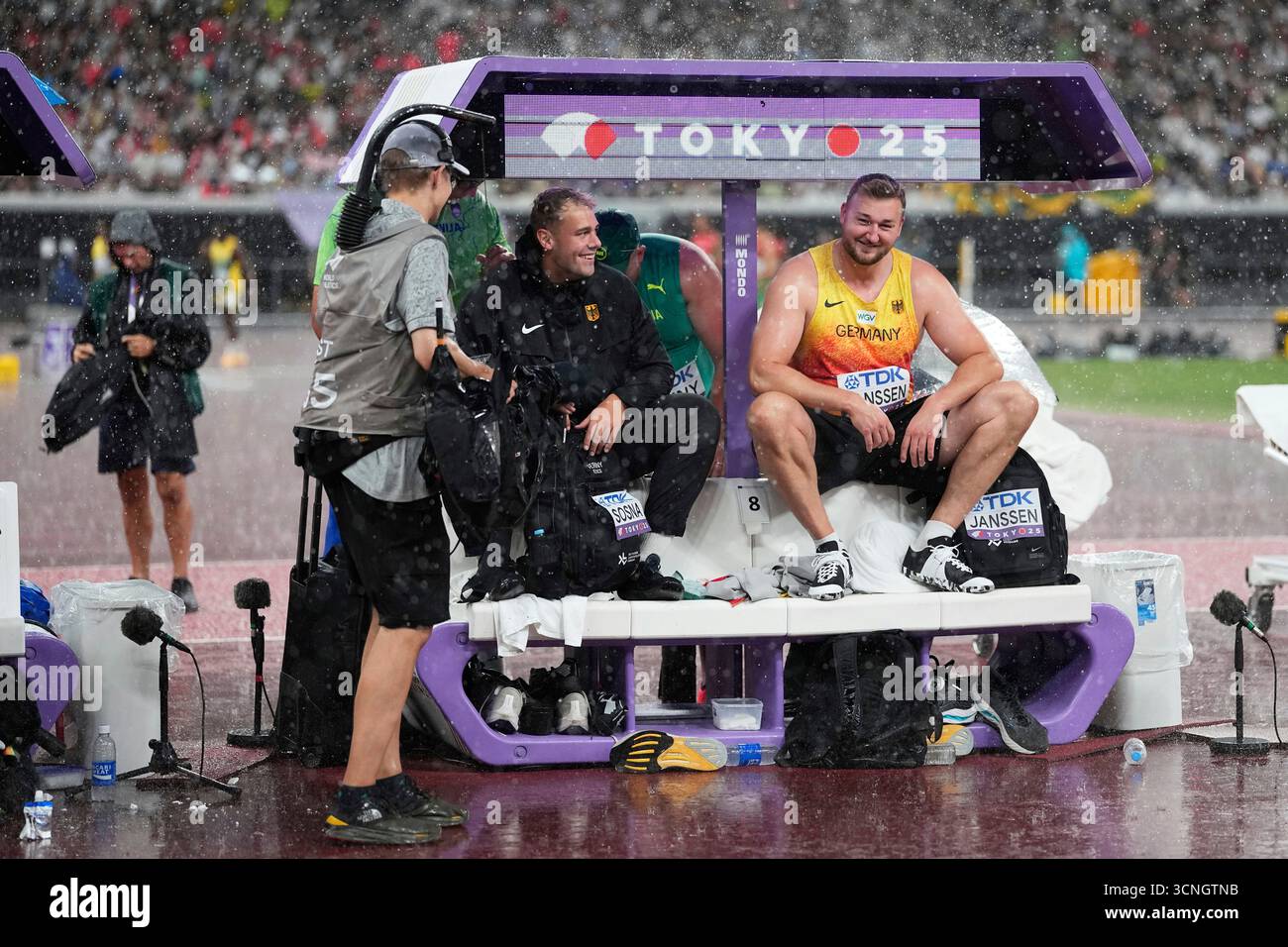 Germany's Mika Sosna and Henrik Janssen shelter from the rain during ...