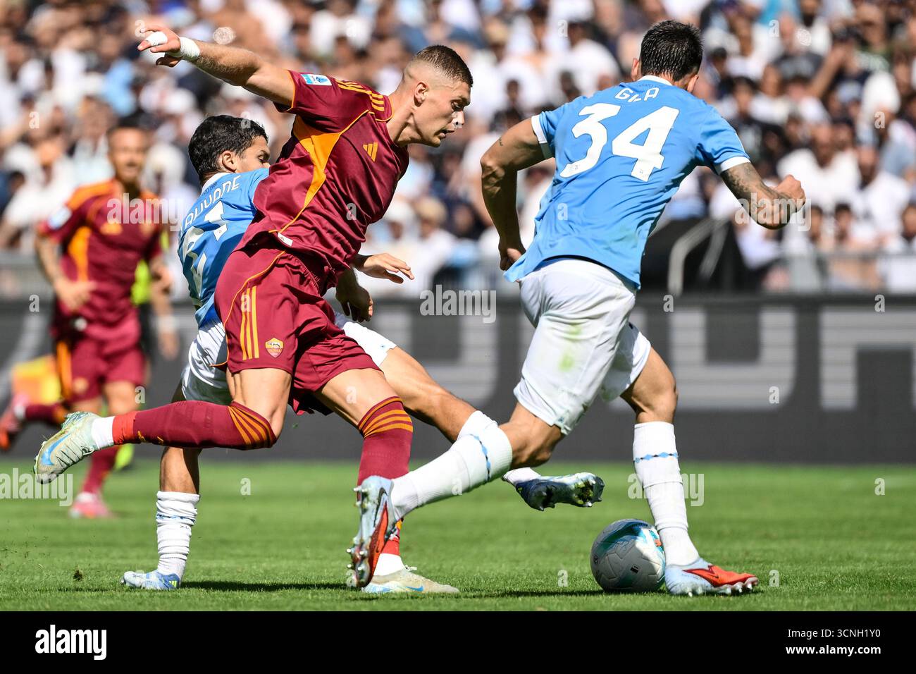 Reda Belahyane of SS Lazio, Evan Ferguson of AS Roma and Mario Gila of ...