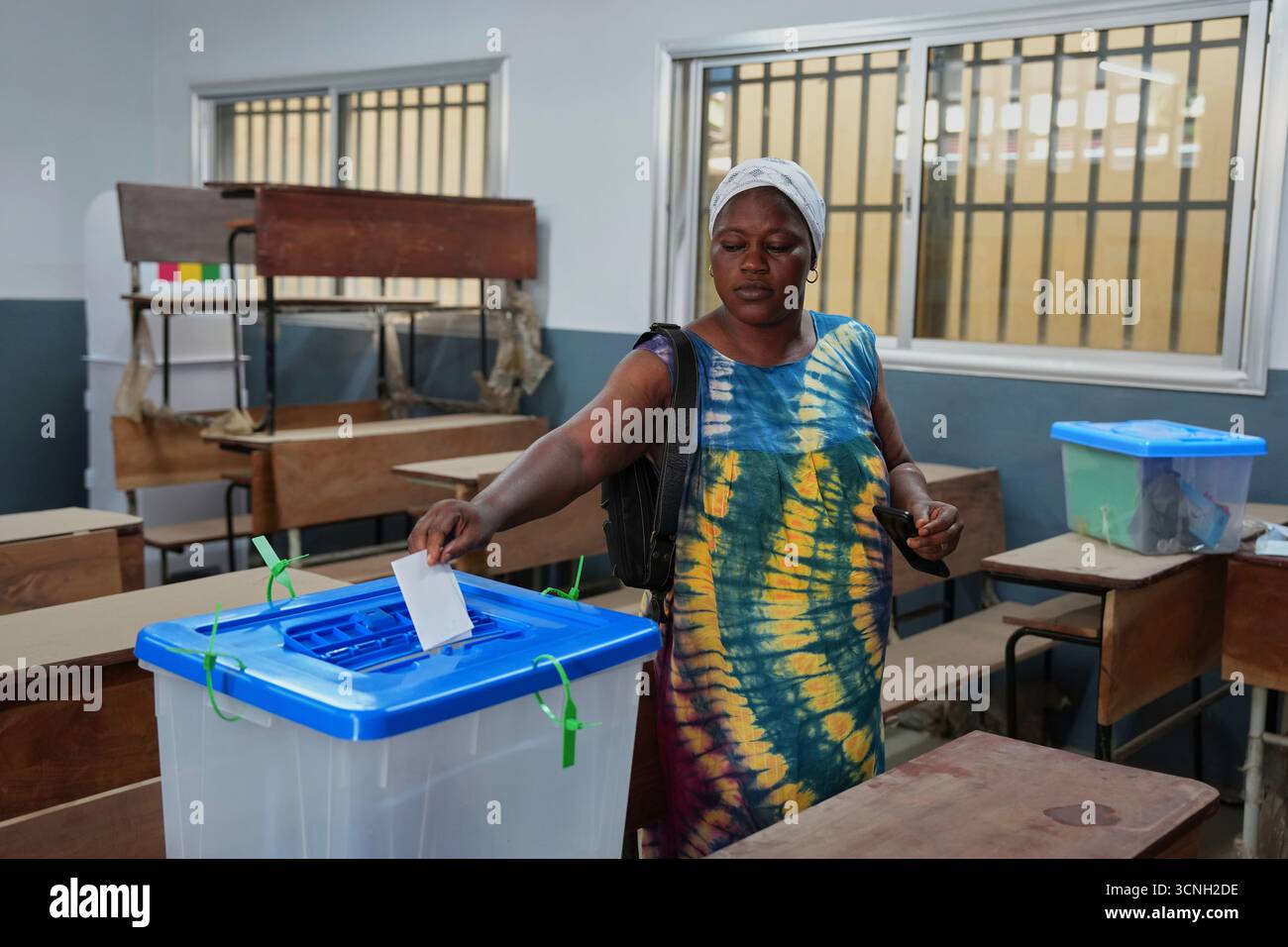 A woman casts her ballot during the constitutional referendum in ...