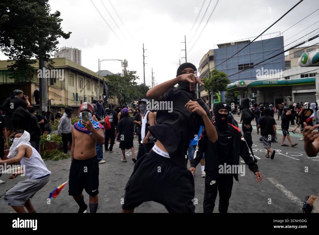 Protesters clash with anti-riot police at Ayala Bridge, Manila, during ...