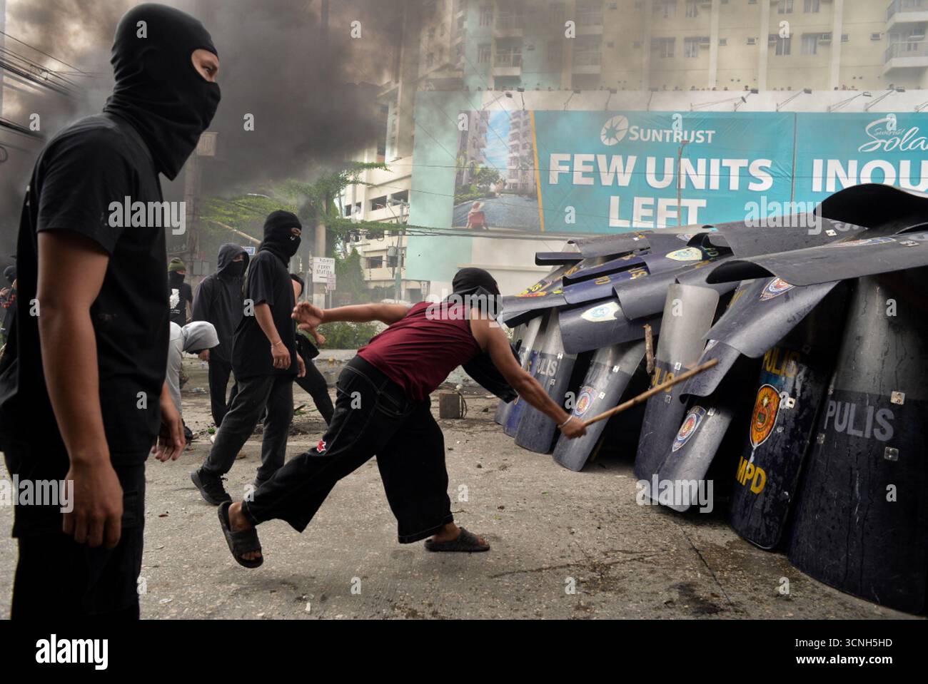 Protesters clash with anti-riot police at Ayala Bridge, Manila, during ...