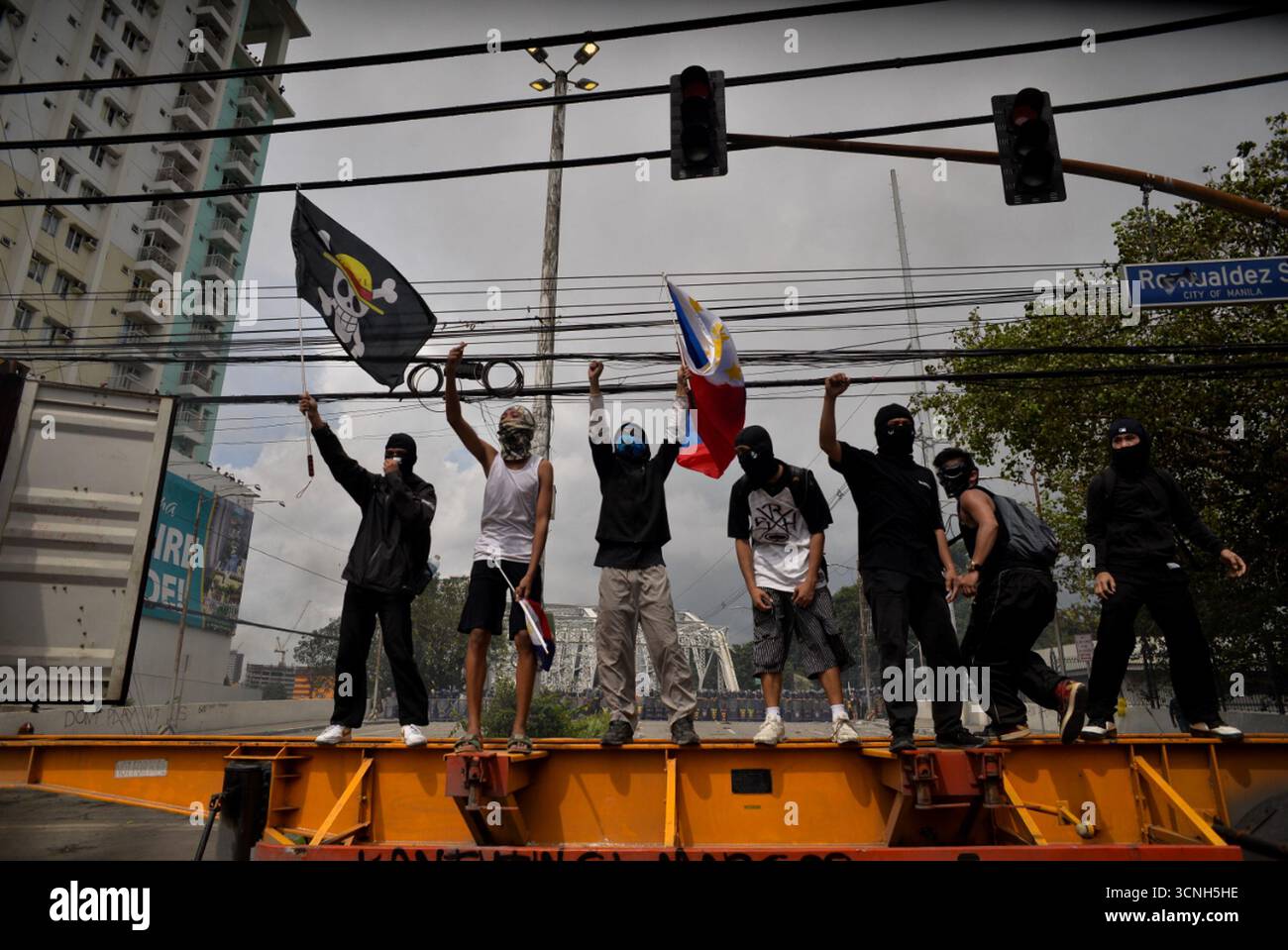 Protesters clash with anti-riot police at Ayala Bridge, Manila, during ...