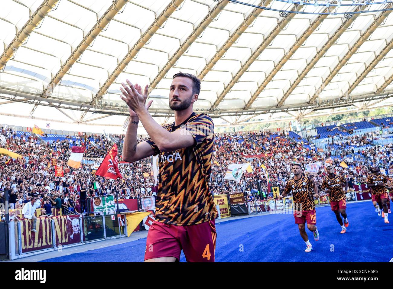 Rome, Italy, 21 September, 2025. Roma players enter the pitch for the ...