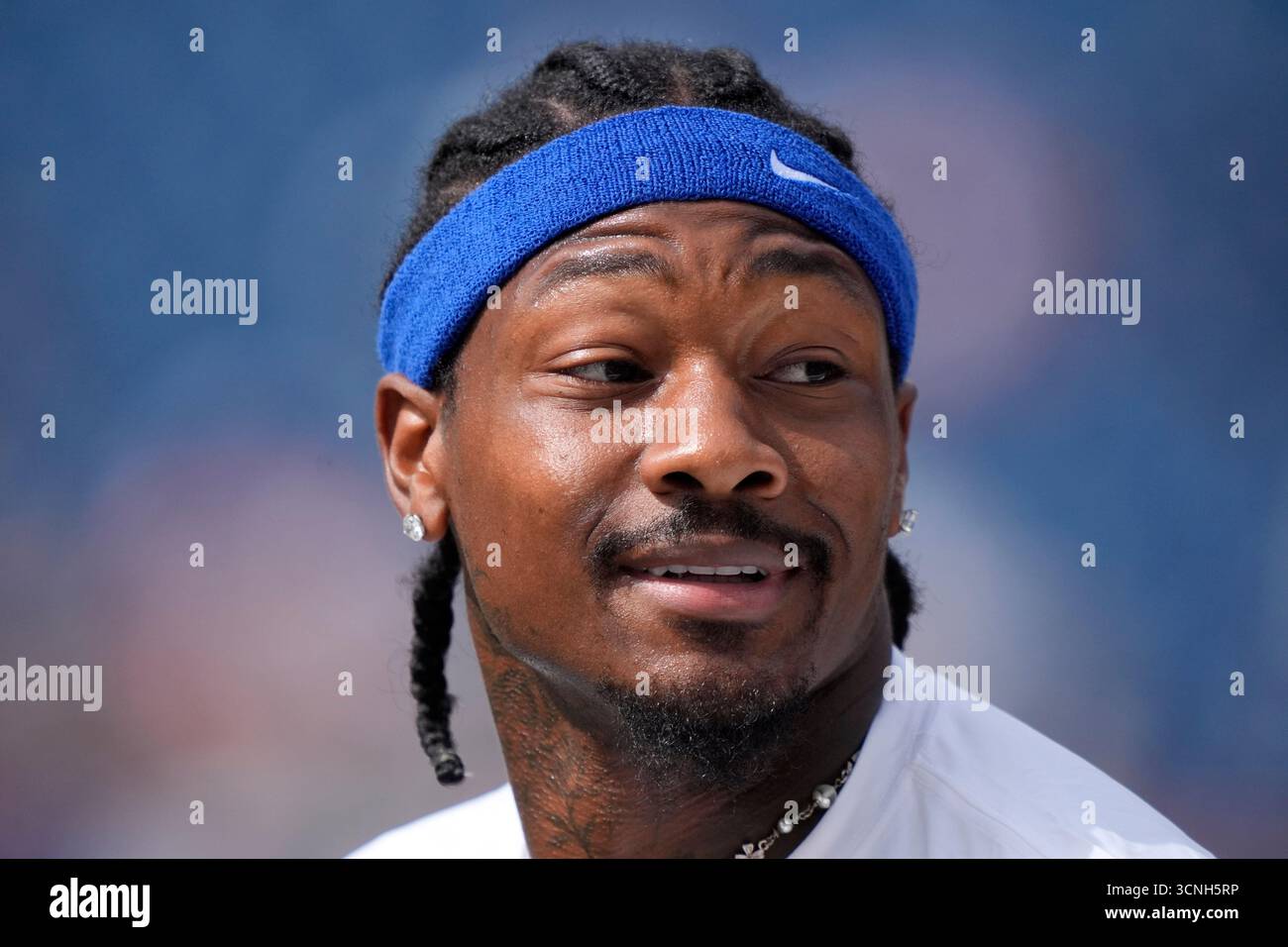 New England Patriots wide receiver Stefon Diggs (8) looks on before an ...