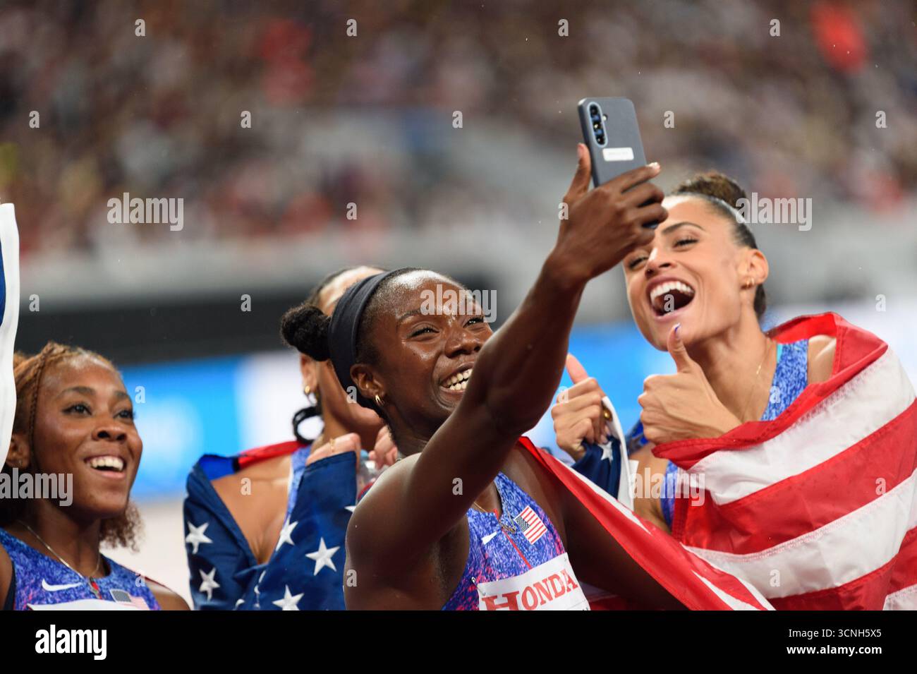 The 4x400 metres relay team of the United States taking a selfie after ...