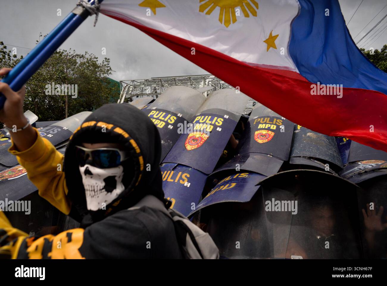 Protesters clash with anti-riot police at Ayala Bridge, Manila, during ...