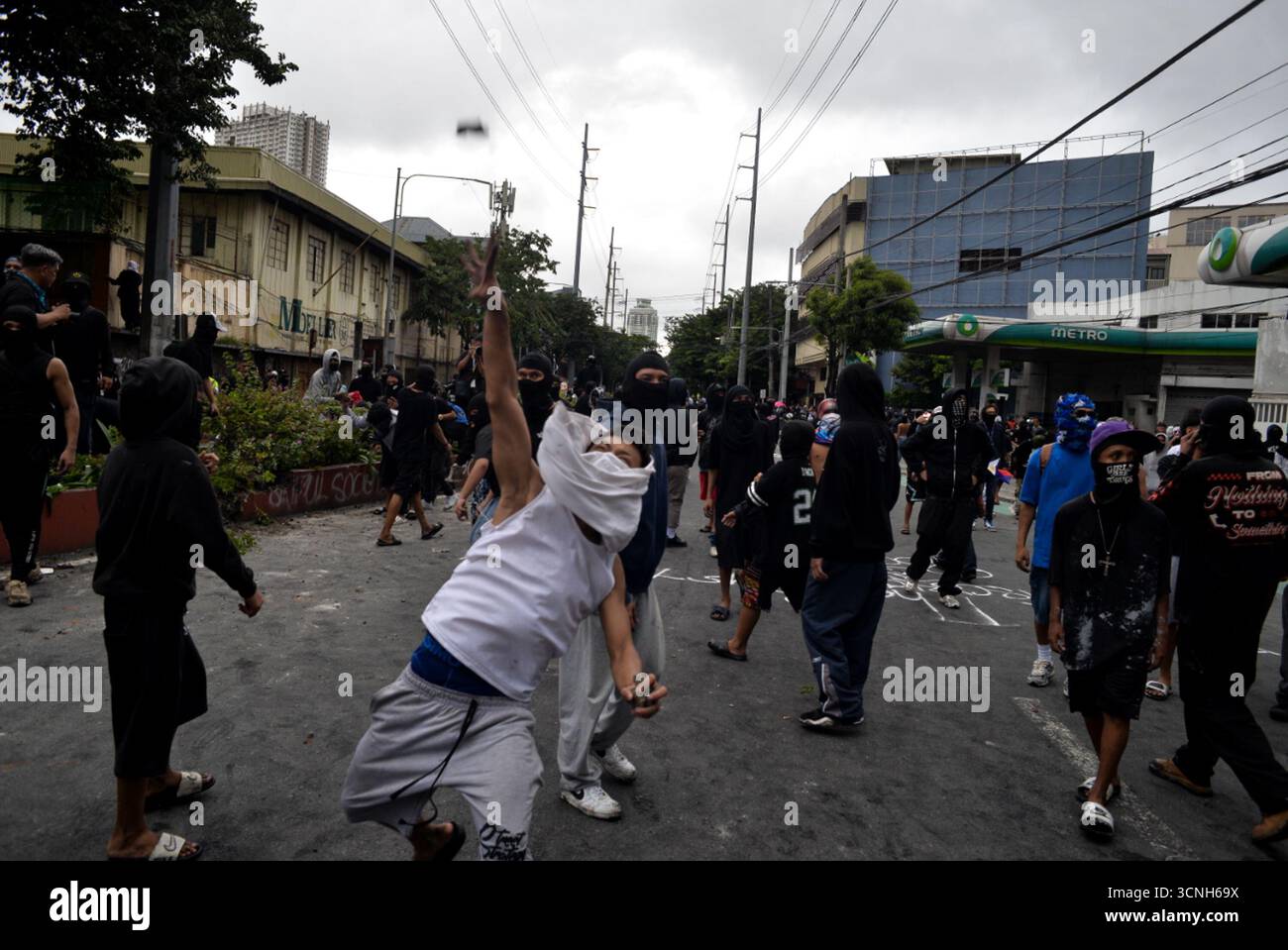 Protesters clash with anti-riot police at Ayala Bridge, Manila, during ...