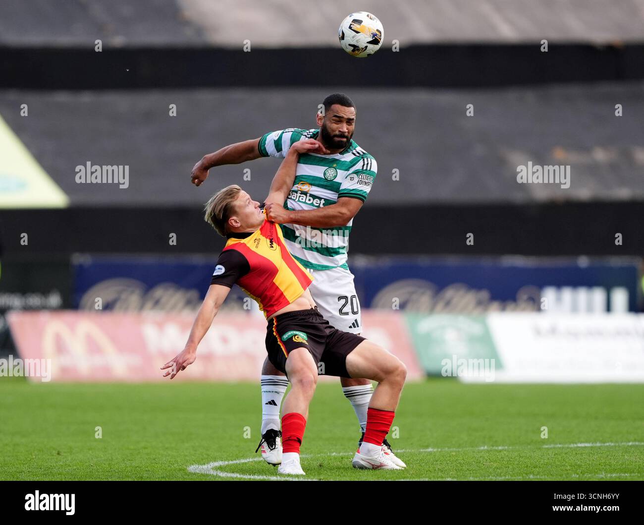 Partick Thistle's Alex Samuel (left) and Celtic's Cameron Carter ...