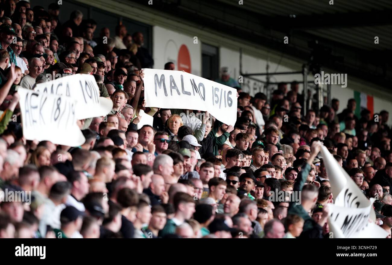 Celtic fans hold up banners in the stands during the Premier Sports Cup ...