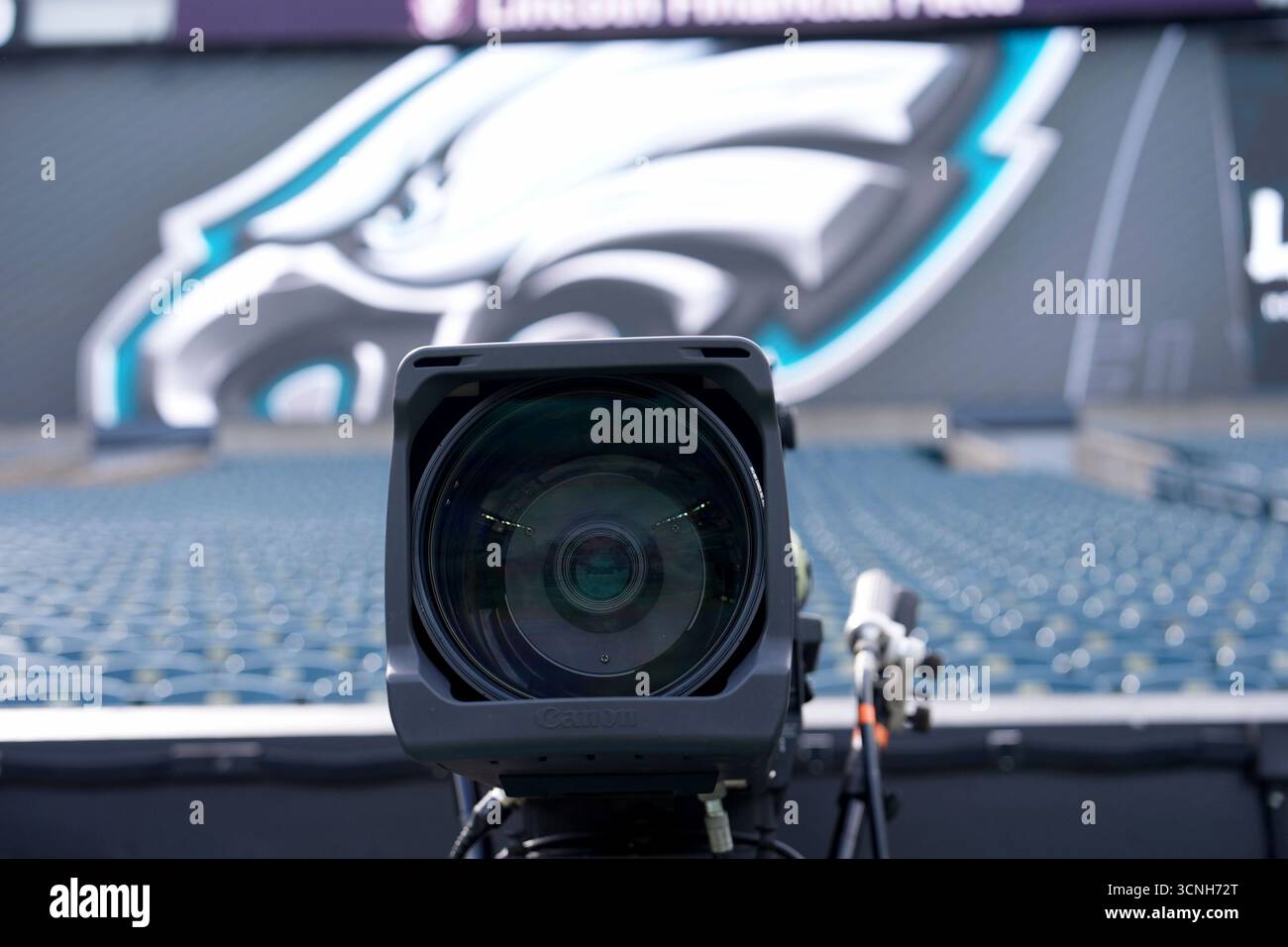 A television camera is seen before an NFL football game between the ...