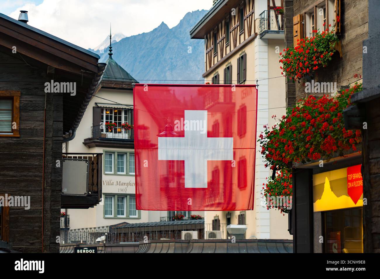 Evening scene in Zermatt town center with tourists, restaurants, shops ...