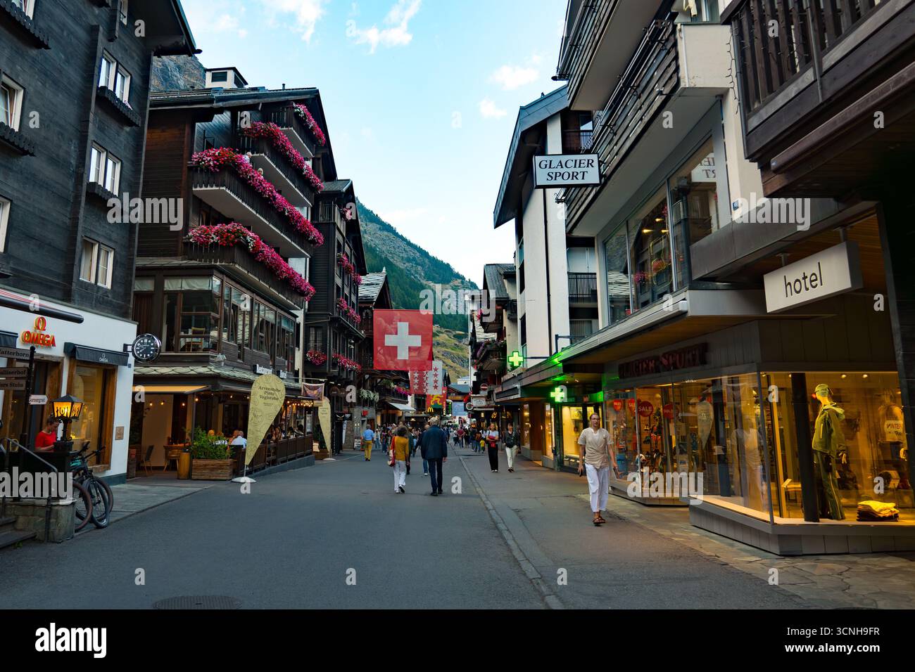 Evening scene in Zermatt town center with tourists, restaurants, shops ...