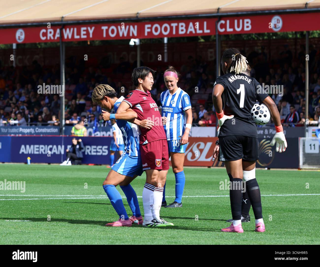 Moeka Minami (Brighton 3) helping her Japanese team mate Riko Ueki ...
