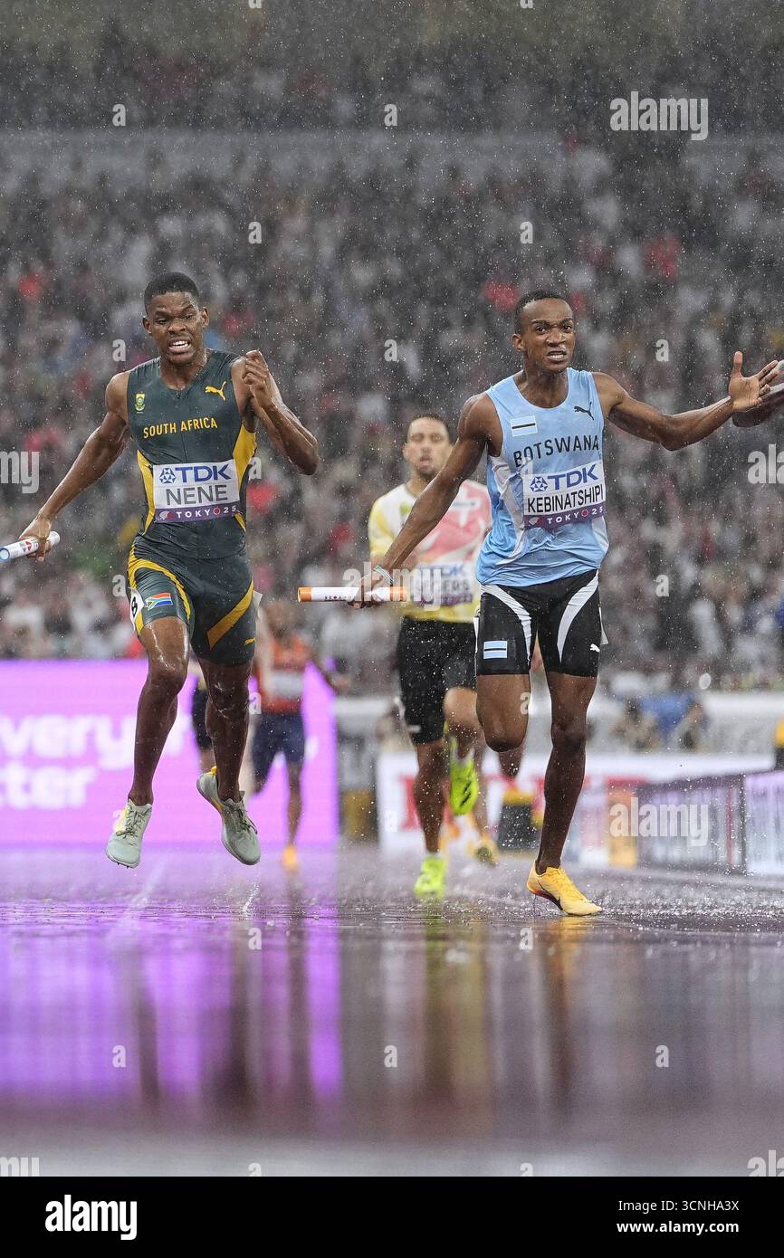 Busang Collen Kebinatshipi (R) of Botswana crosses the finish line to ...