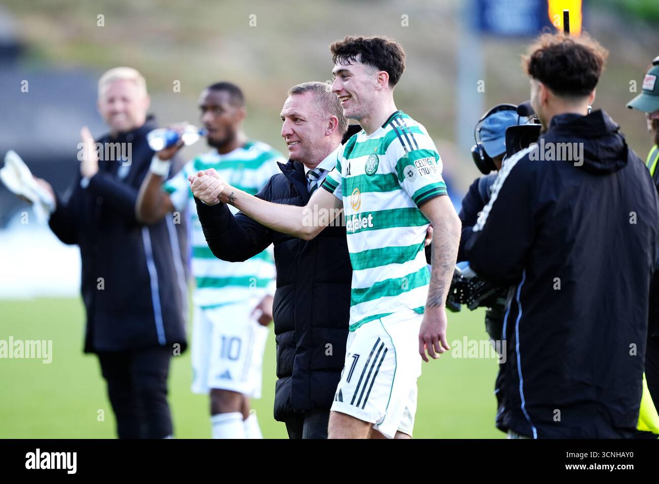 Celtic's Colby Donovan (left) celebrates with manager Brendan Rodgers ...