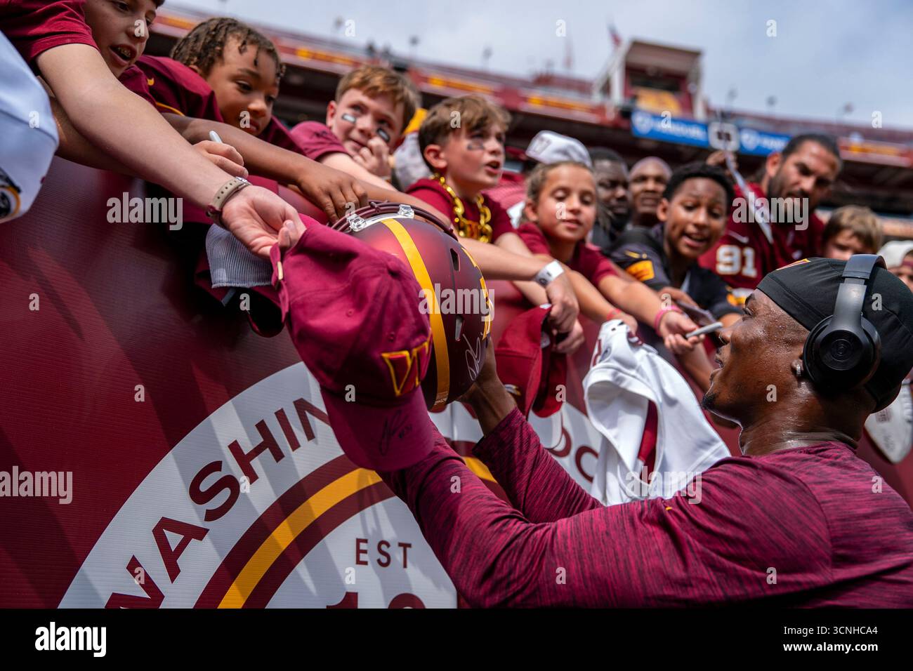 Washington Commanders wide receiver Terry McLaurin (17) signs fans ...