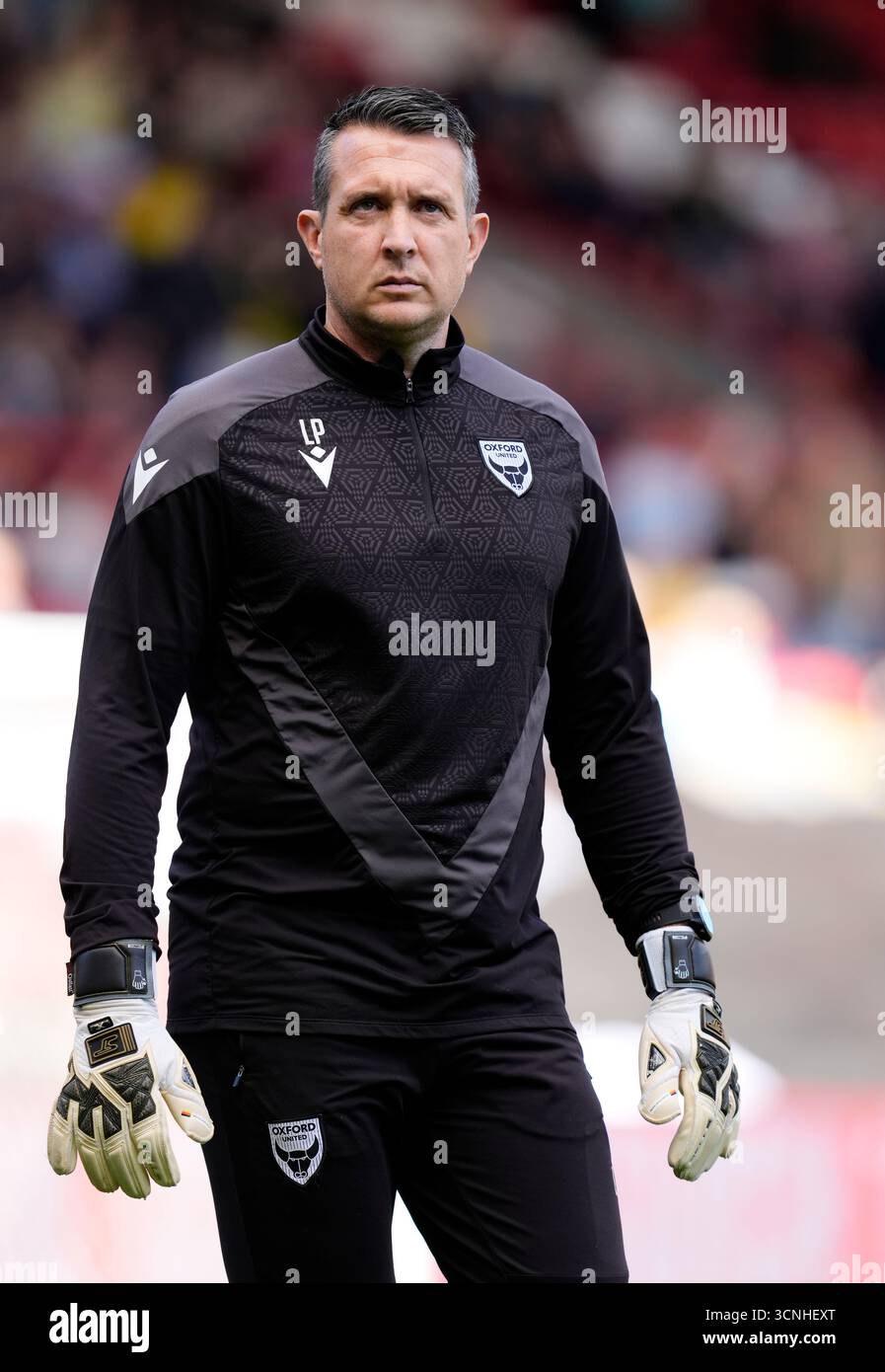 Oxford United goalkeeping coach Lewis Price during the warm up before ...