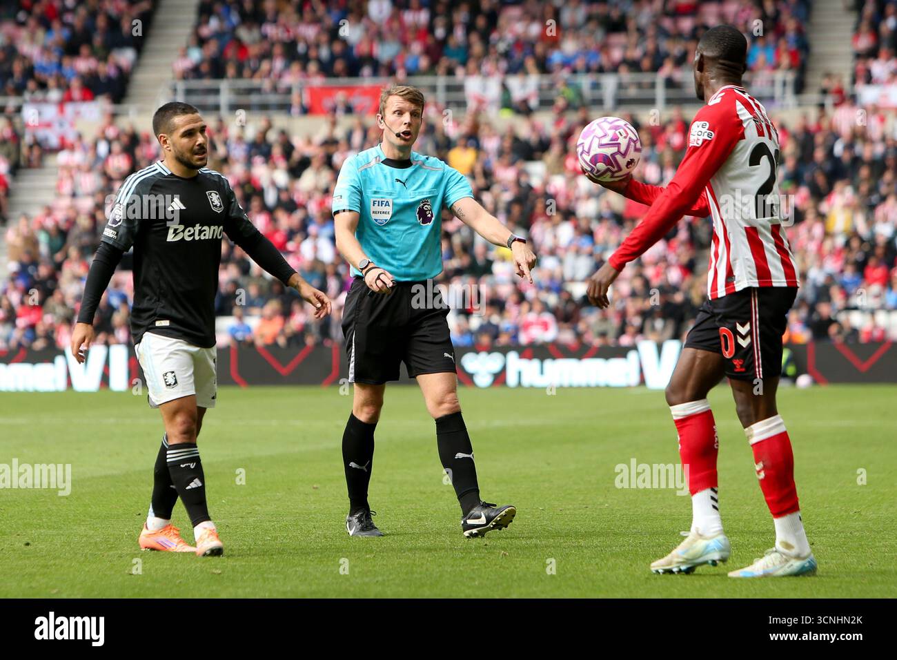Referee Sam Barrott gestures towards Nordi Mukiele during the Premier ...
