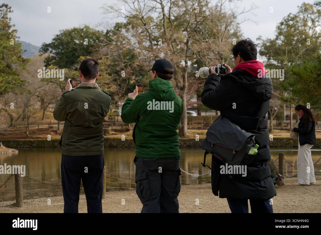 Three photographers capture scene hi-res stock photography and images ...