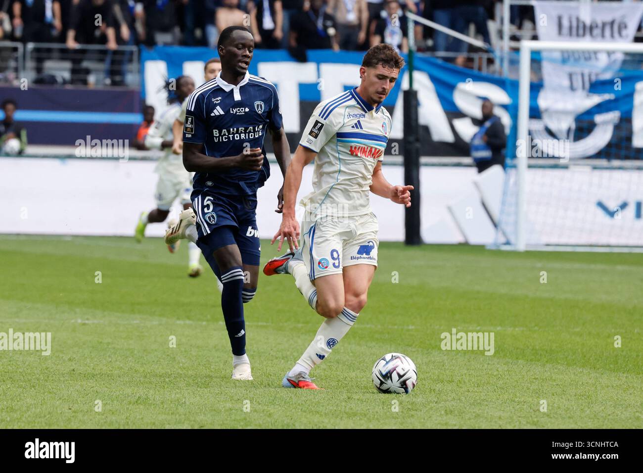 Paris, France. 21st Sep, 2025. PFC's Moustapha Mbow battles Strasbourg ...