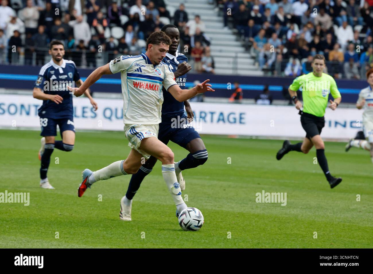 PFC’s Moustapha Mbow battles Strasbourg’s Joaquin Panichelli during the ...