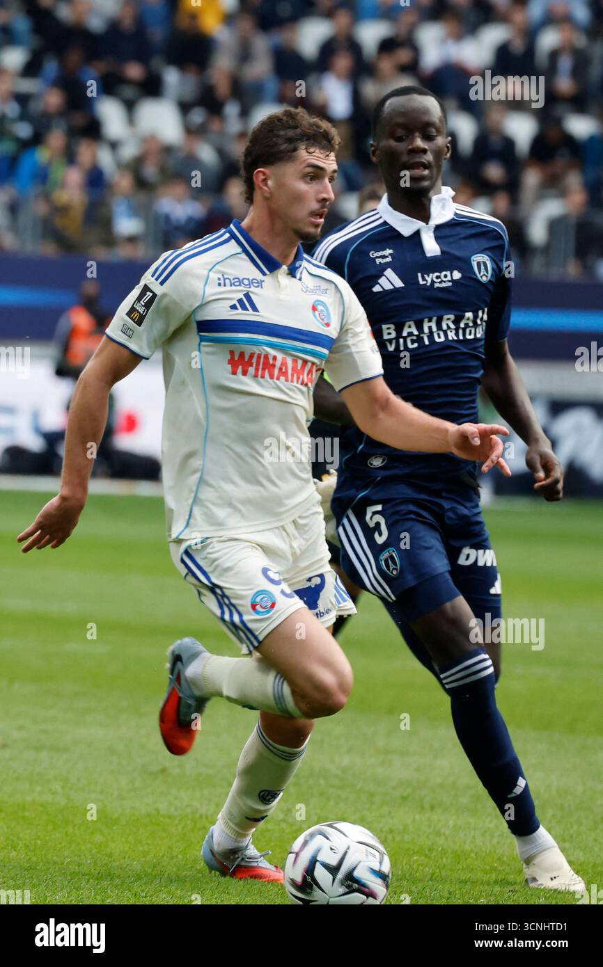 PFC’s Moustapha Mbow battles Strasbourg’s Joaquin Panichelli during the ...