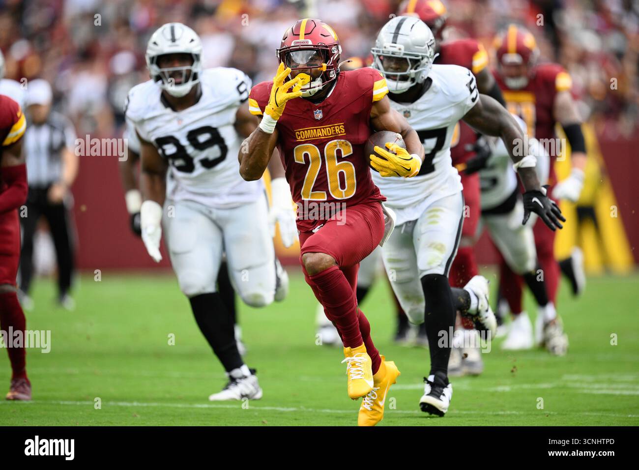 Washington Commanders running back Jeremy McNichols (26) runs in a ...
