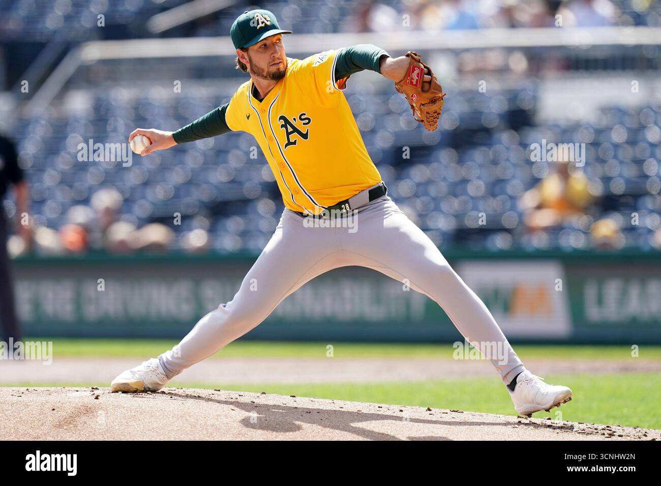Athletics pitcher Mitch Spence delivers during the first inning of a ...