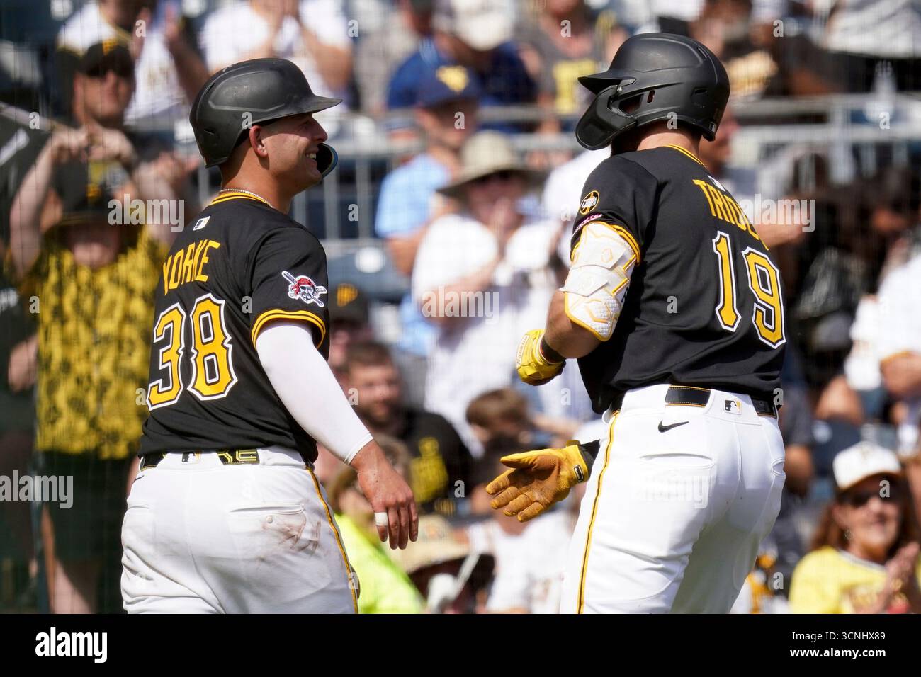 Pittsburgh Pirates' Jared Triolo, right, is greeted by Nick Yorke, left ...