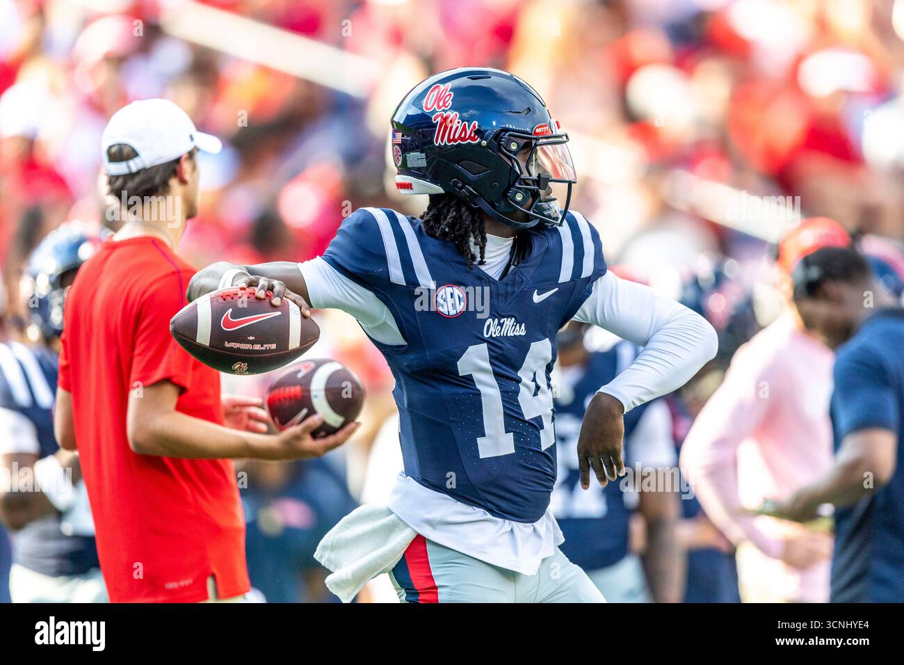 Mississippi quarterback AJ Maddox (14) warms up before entering the ...