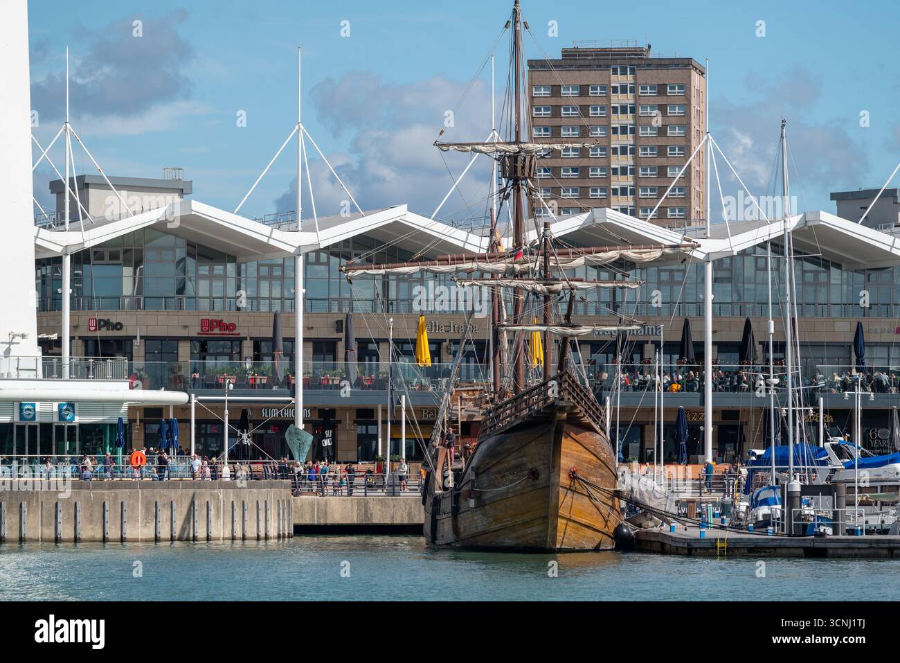 The Nao Santa Maria docked underneath the Spinnaker Tower in Gunwharf ...