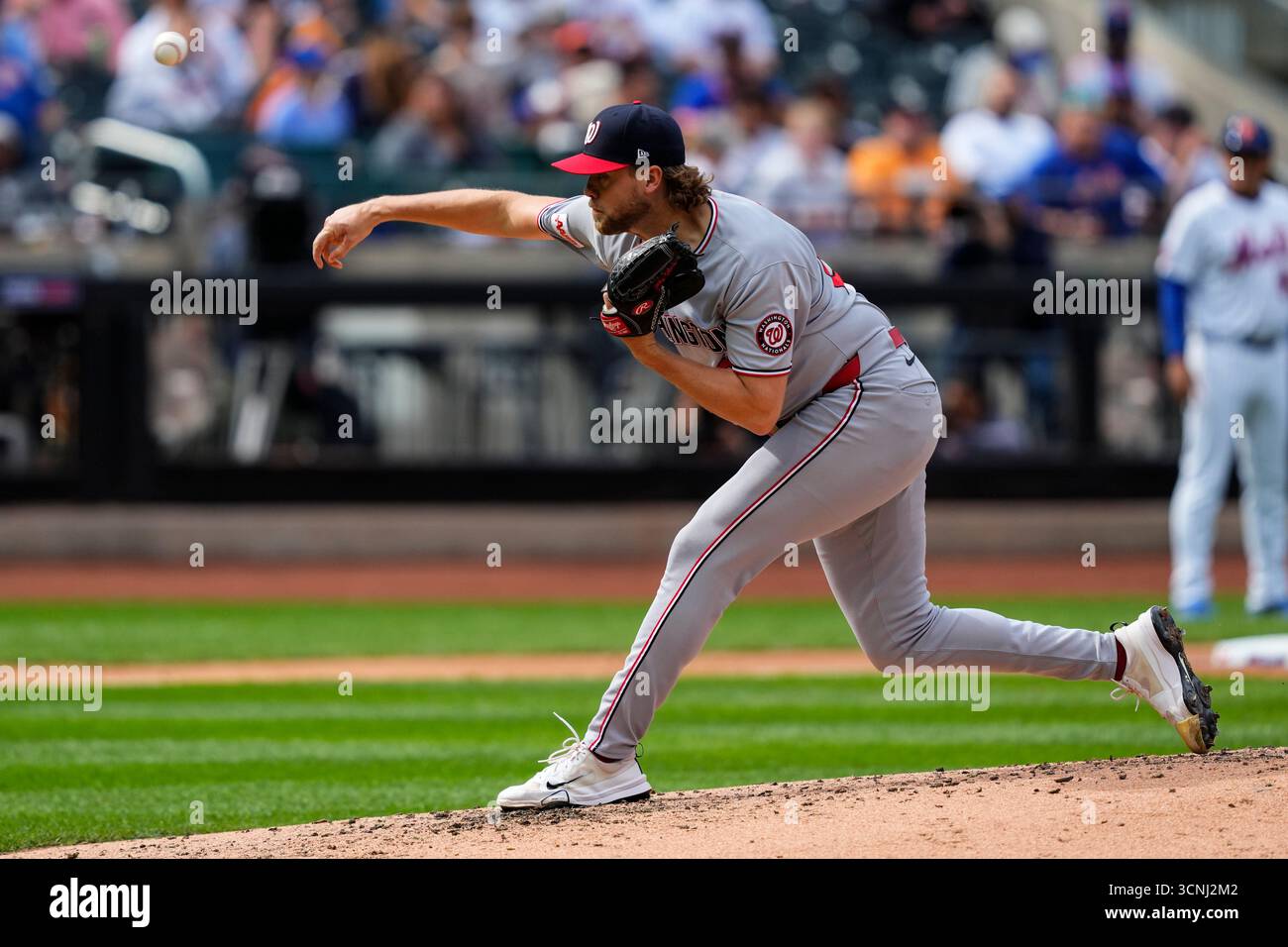 Washington Nationals pitcher Jake Irvin (27) throws during the third ...