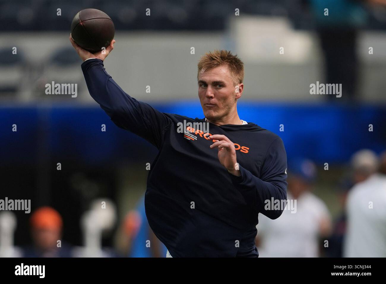 Denver Broncos quarterback Bo Nix warms up before an NFL football game ...