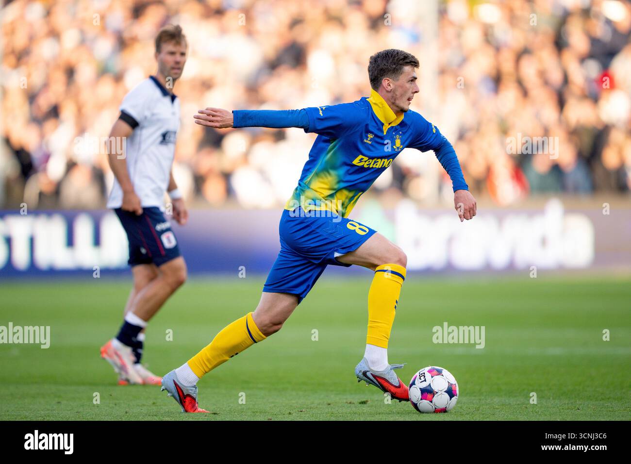 Broendby's Benjamin Tahirovic in front of AGF's Patrick Mortensen ...
