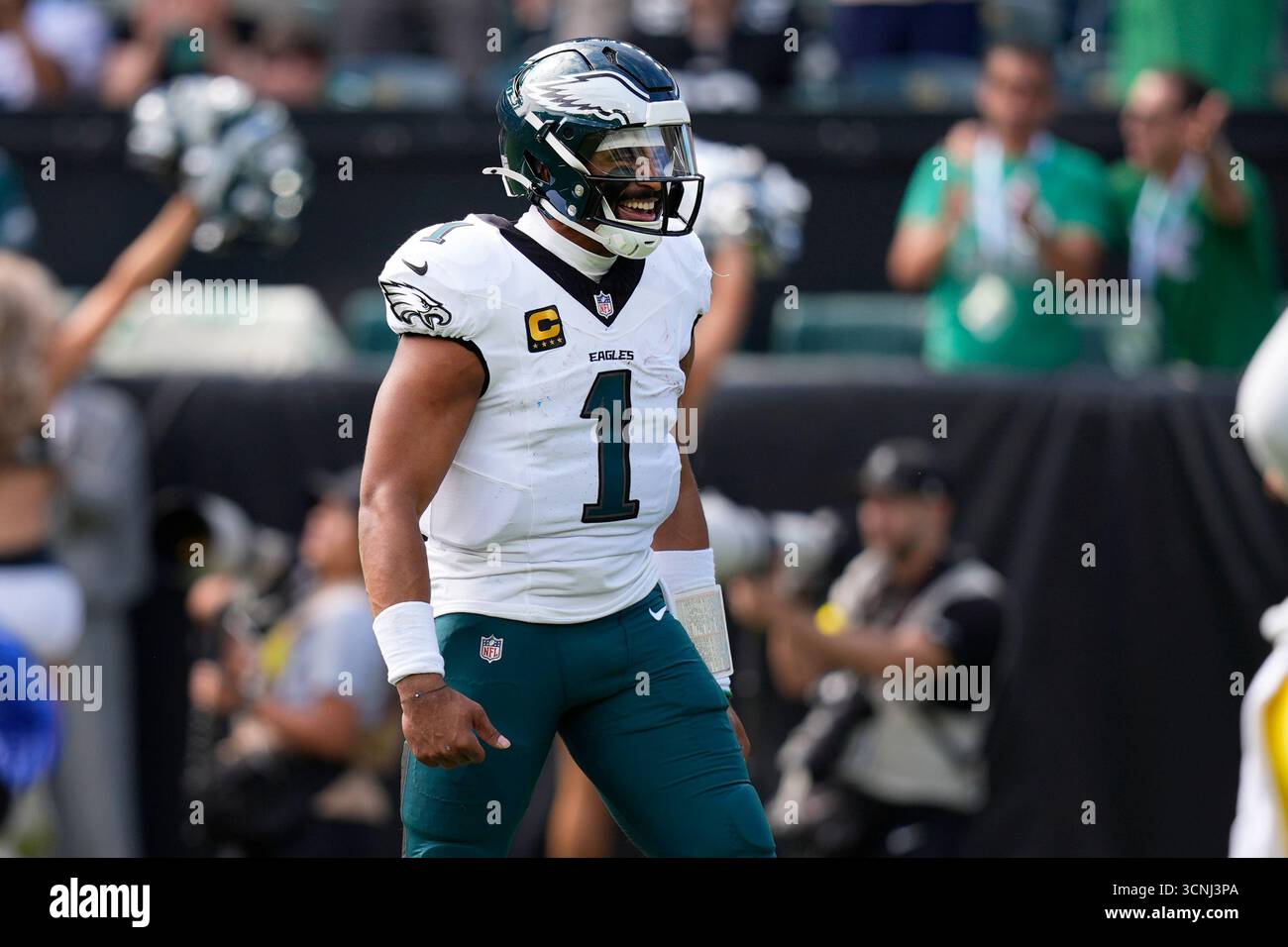 Philadelphia Eagles quarterback Jalen Hurts (1) smiles after throwing a touchdown pass during ...
