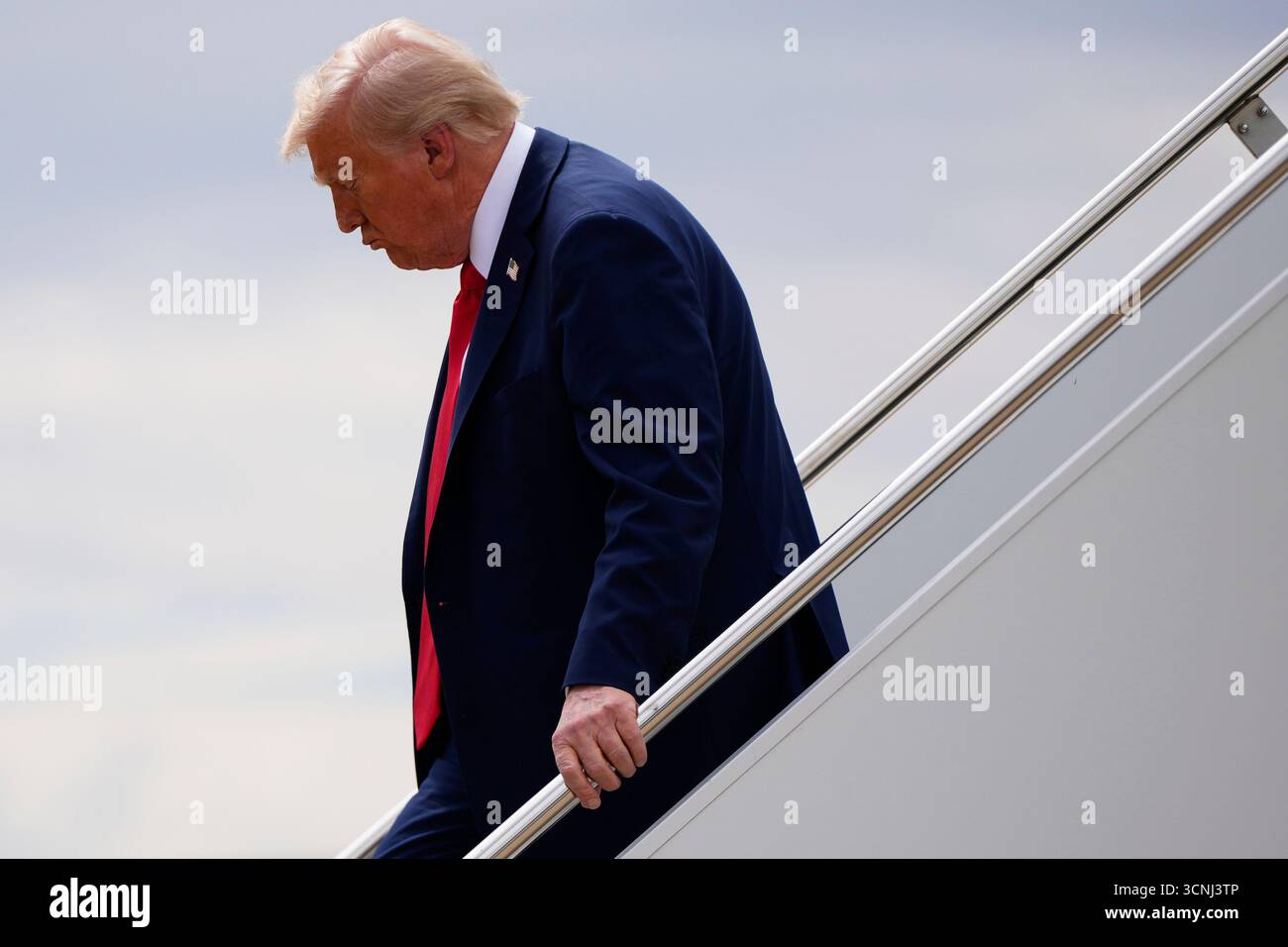 President Donald Trump disembarks Air Force One, Sunday, Sept. 21, 2025 ...