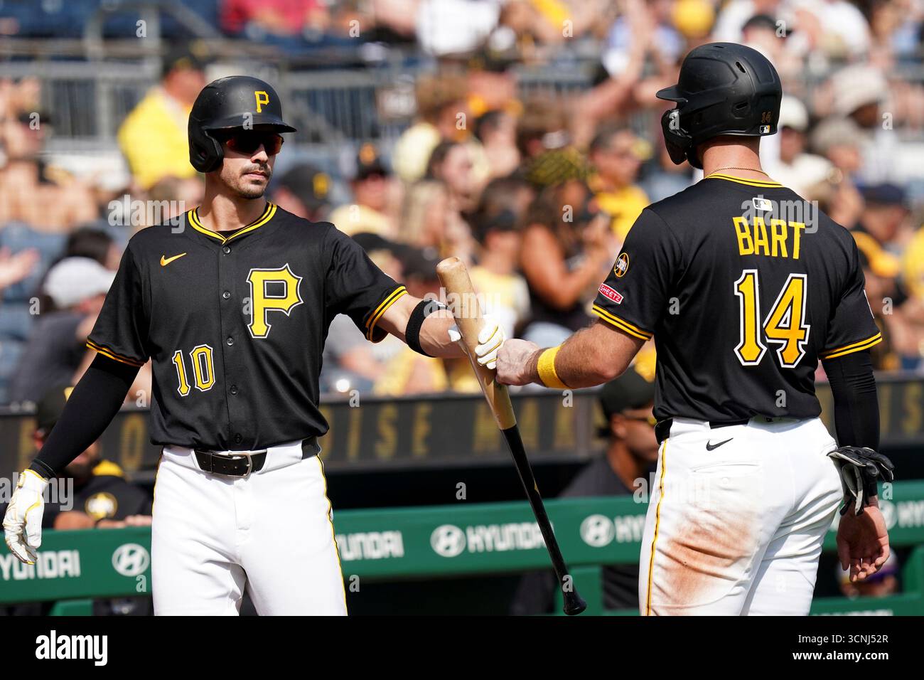 Pittsburgh Pirates' Joey Bart, right, is greeted by Bryan Reynolds ...