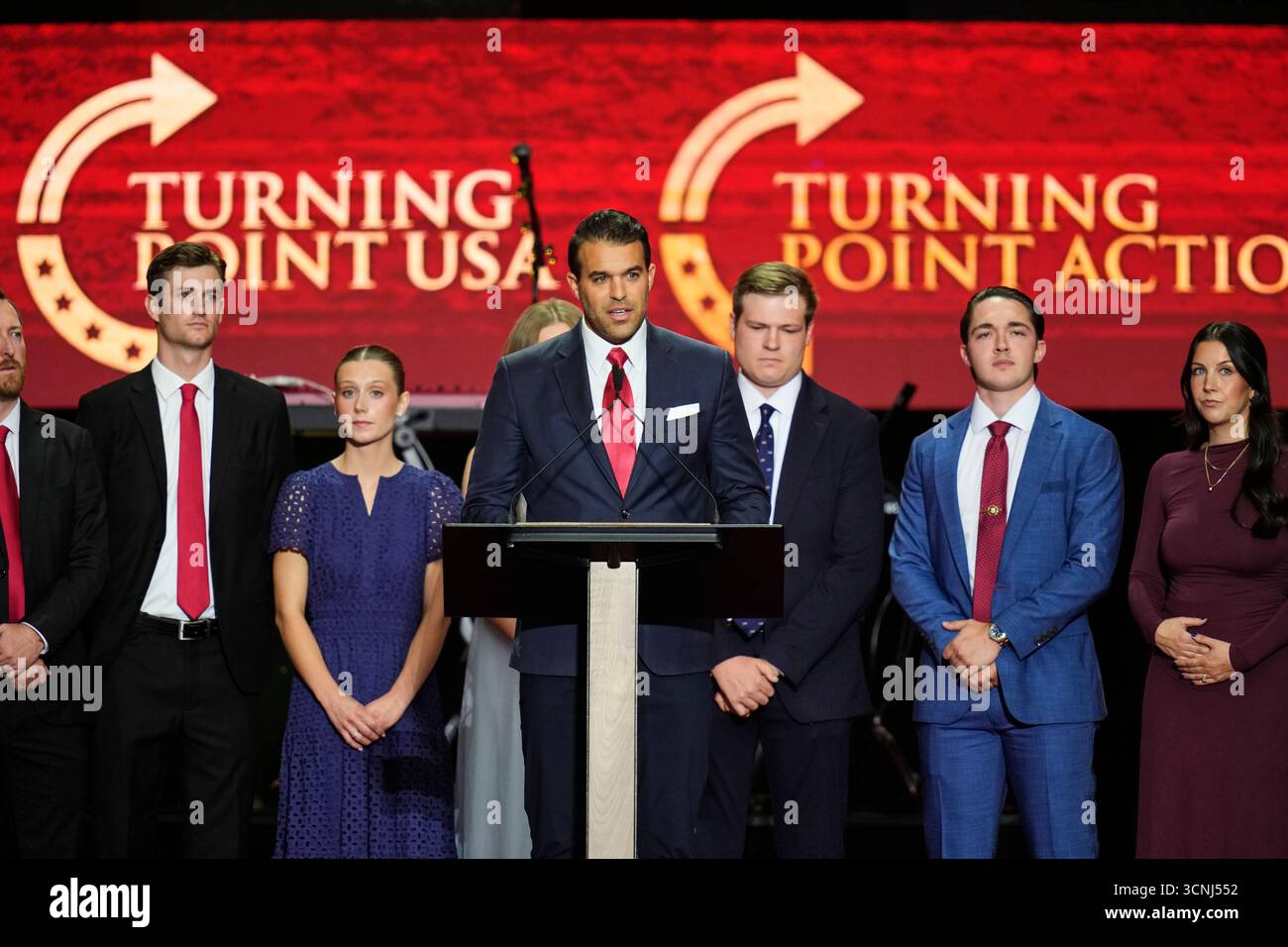 Andrew Kolvet, center, speaks at a memorial for conservative activist ...