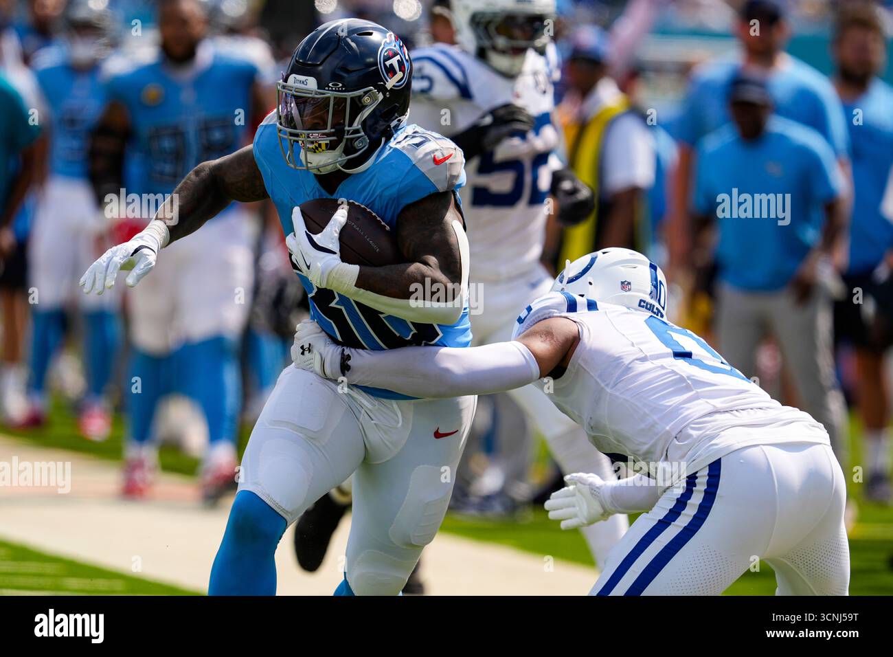 Tennessee Titans running back Julius Chestnut (36) is tackles by ...