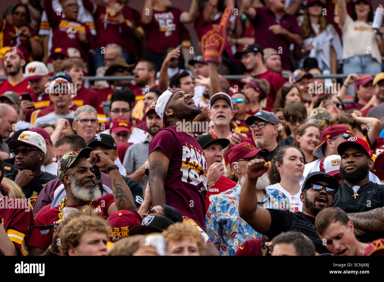 A Washington Commanders fan sings "Hail to the Commanders" after a ...
