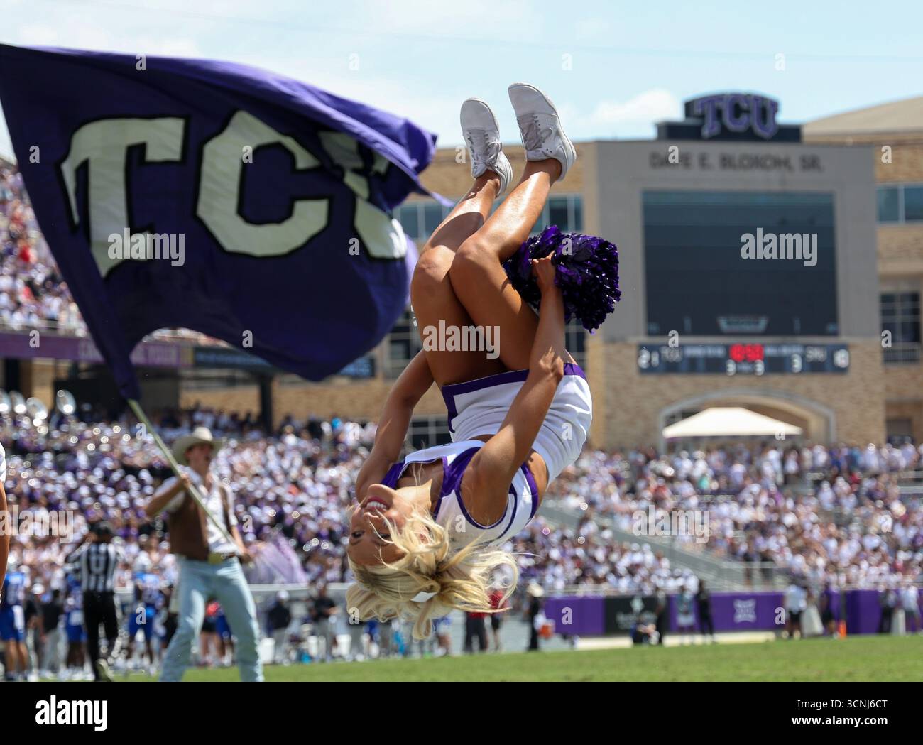 September 20, 2025: A TCU cheerleader flips before the crowd during a ...
