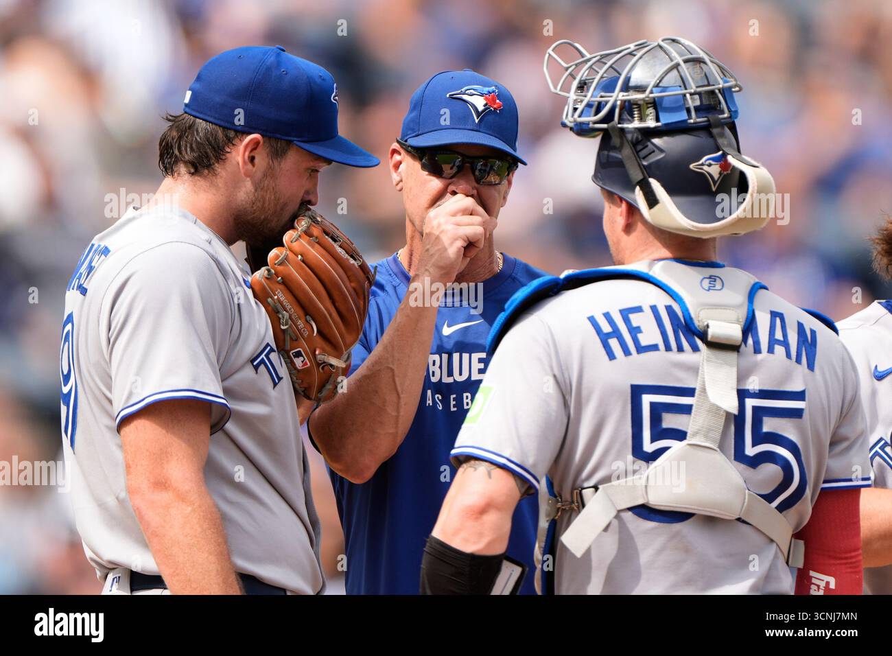 Toronto Blue Jays pitching coach Pete Walker talks to catcher Tyler ...