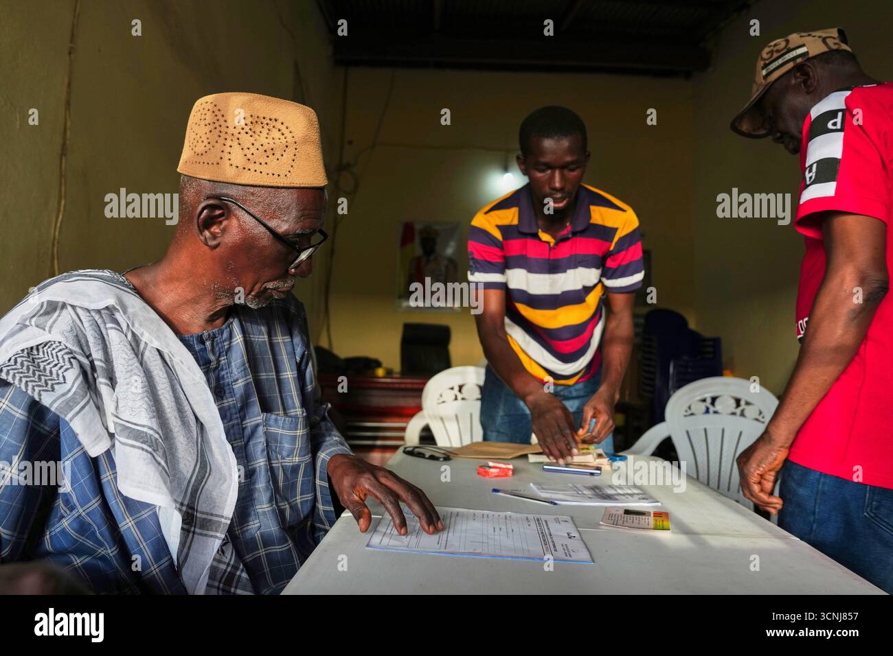 Officials work at a polling station during the constitutional ...