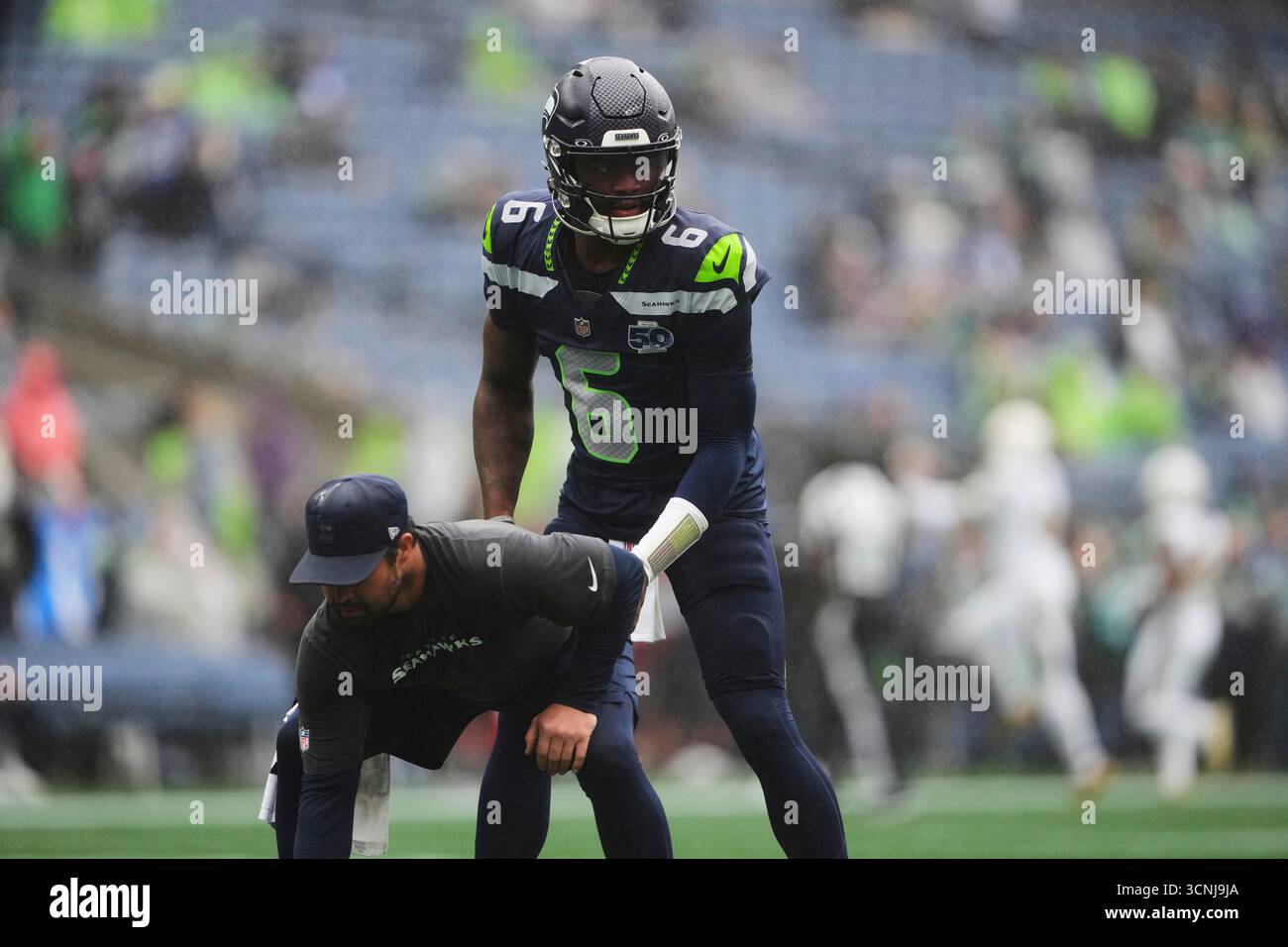 Seattle Seahawks quarterback Jalen Milroe (6) warms up before an NFL ...
