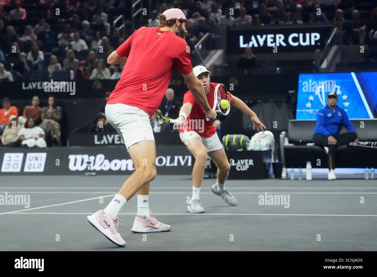 Team World's Reilly Opelka, of the United States, left, returns a shot ...