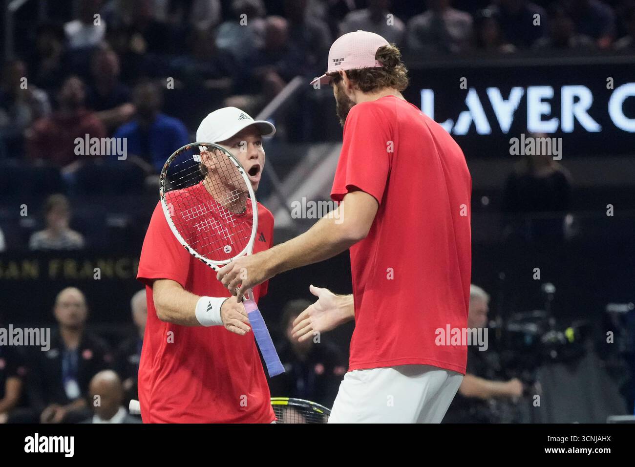 Team World's Alex Michelsen, of the United States, left, celebrates ...