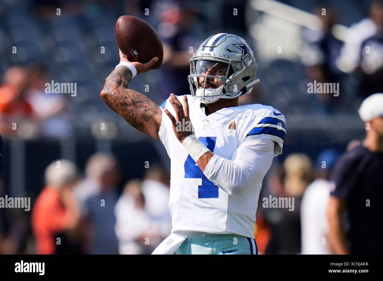 Dallas Cowboys quarterback Dak Prescott warms up before an NFL football ...