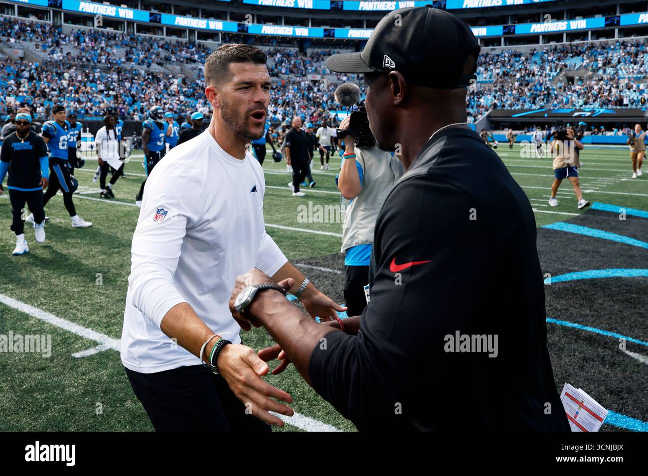Carolina Panthers head coach David Canales greets Atlanta Falcons head ...
