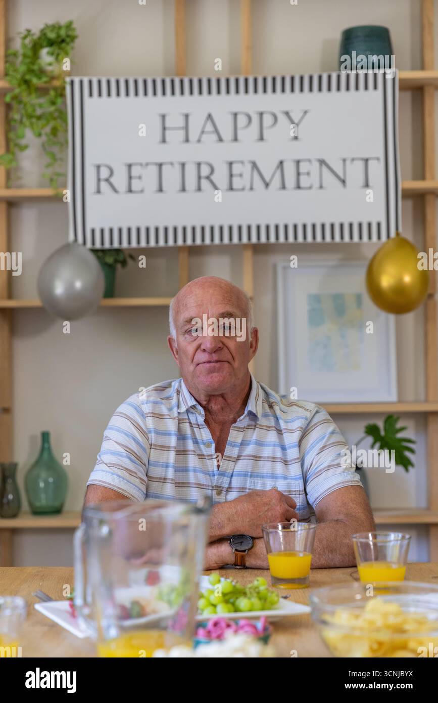 Man sitting table balloons hi-res stock photography and images - Alamy