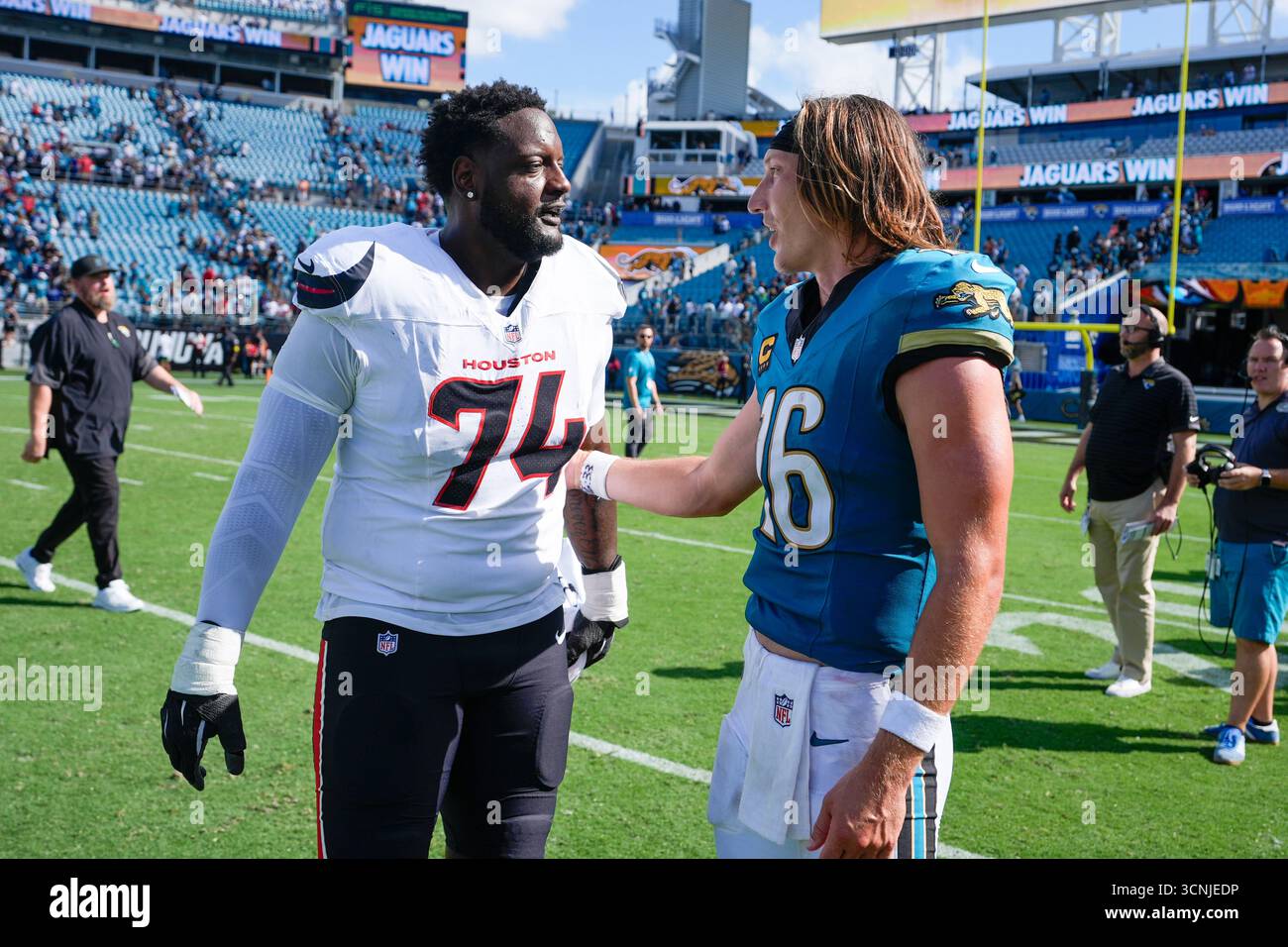 Houston Texans offensive tackle Cam Robinson (74) and Jacksonville ...